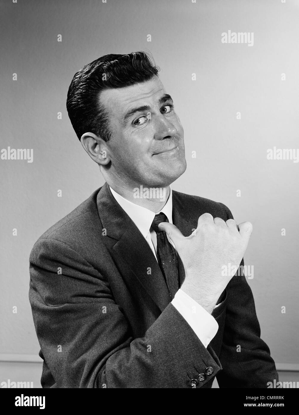 1950s BUSINESS MAN SMILING GIVING THUMBS UP SIGN POINTING TO HIMSELF ...