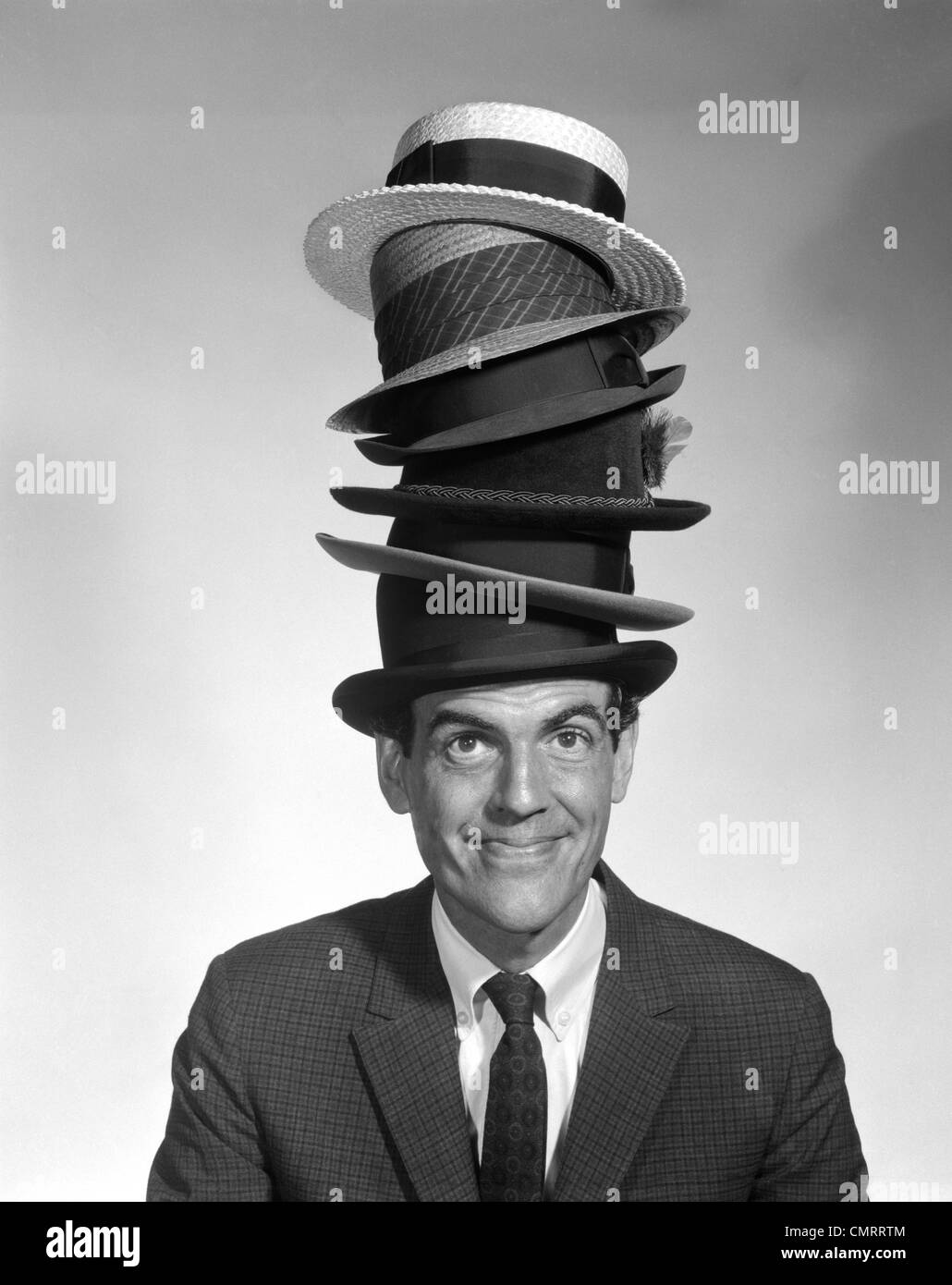 Business people wearing many hats hi-res stock photography and images ...