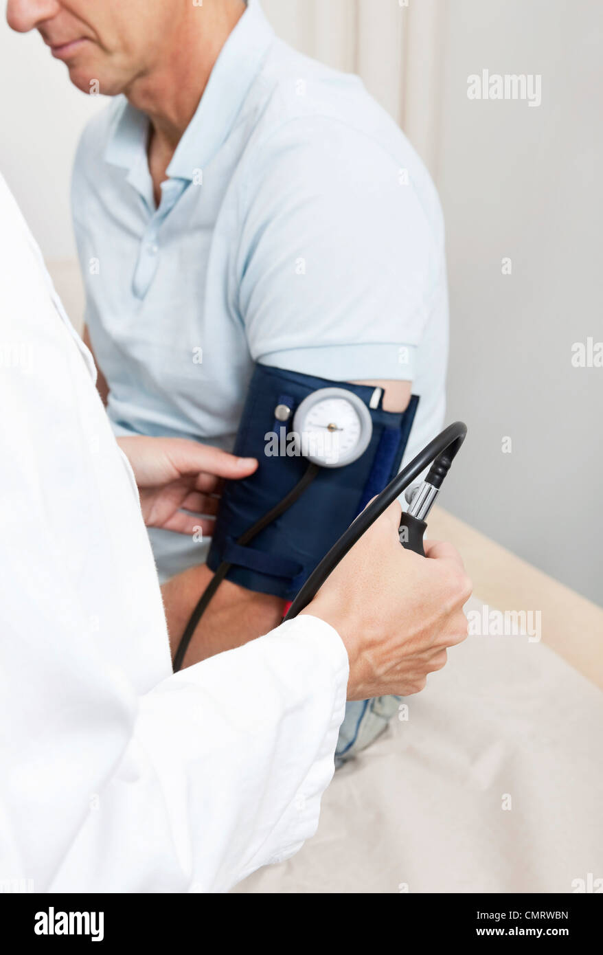 Checking the pulse Stock Photo - Alamy