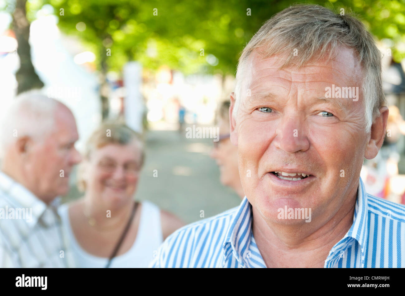 Three men on street hi-res stock photography and images - Alamy