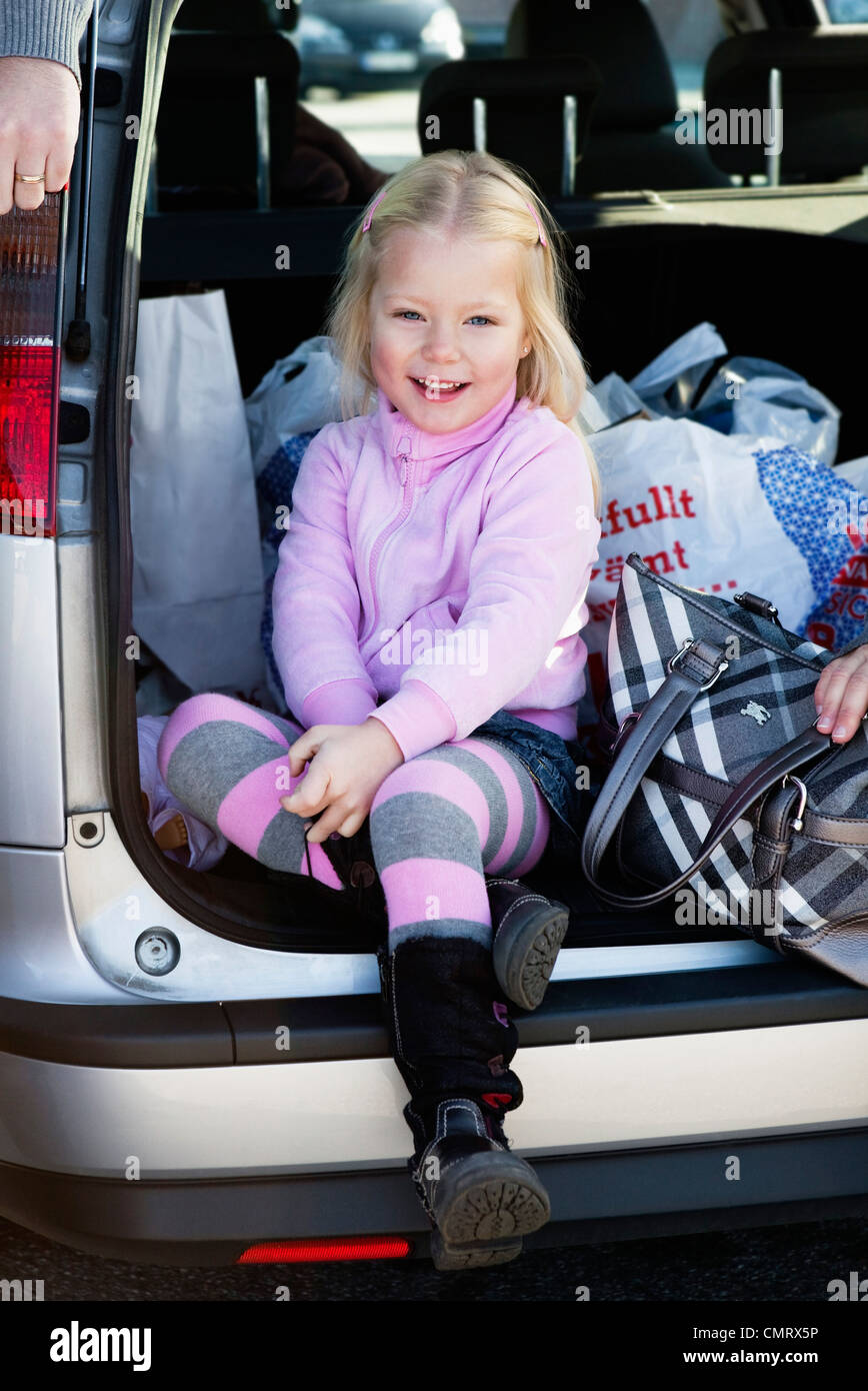 Little girl in trunk Stock Photo - Alamy