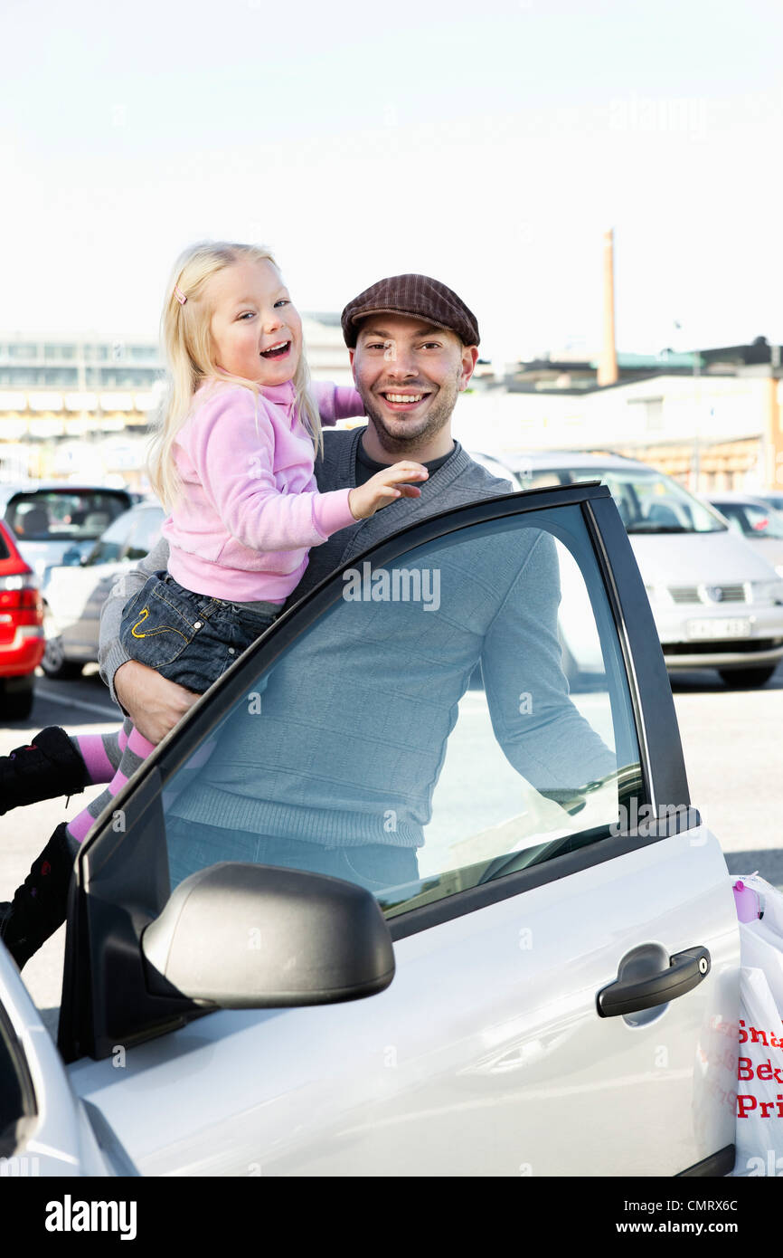 Dad carrying daughter Stock Photo - Alamy