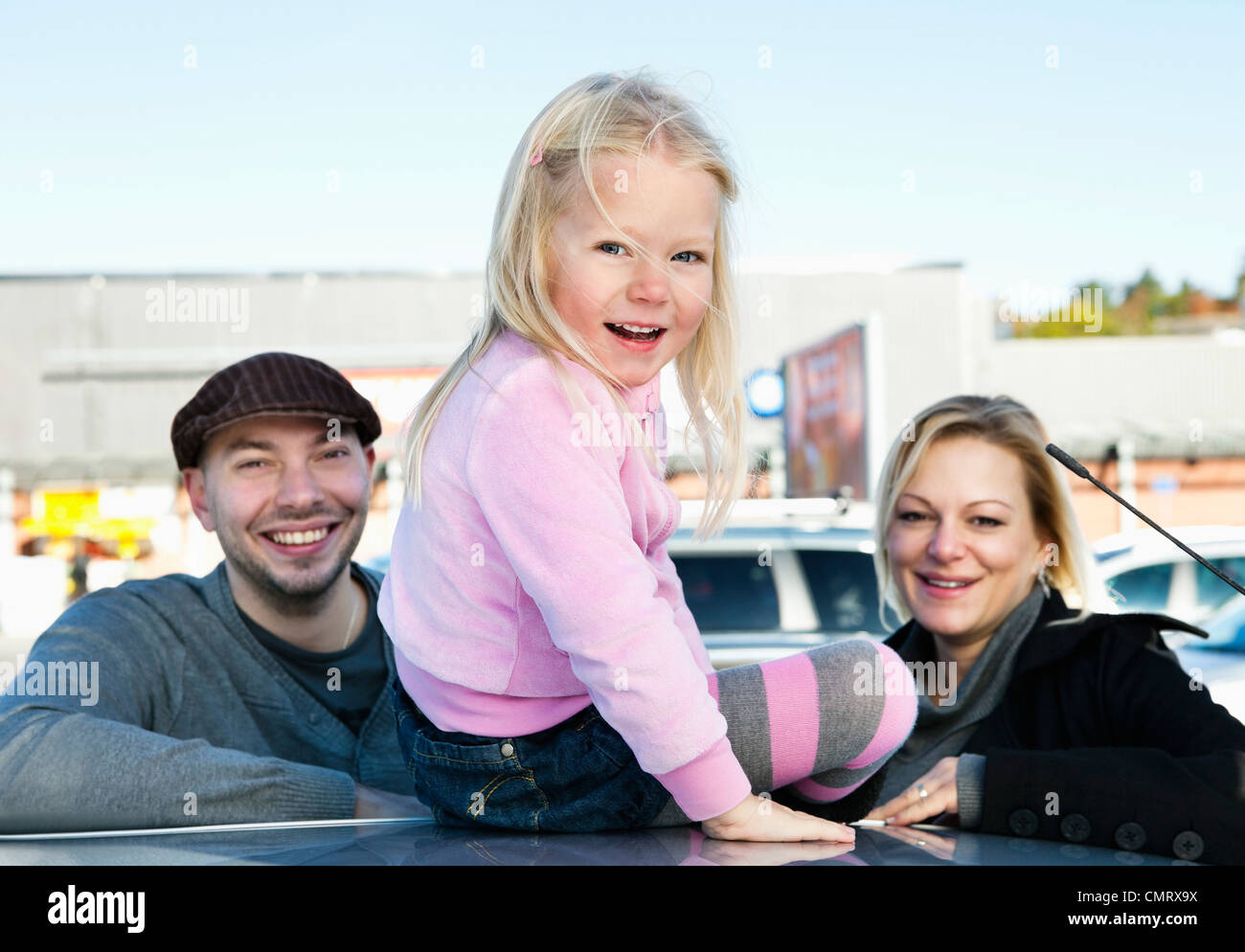 Girl in pink mum dad hi-res stock photography and images - Alamy