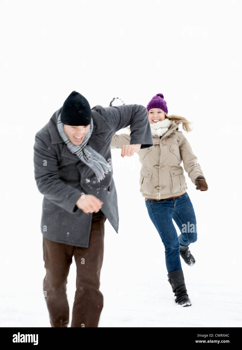 Two throwing snowballs Stock Photo - Alamy