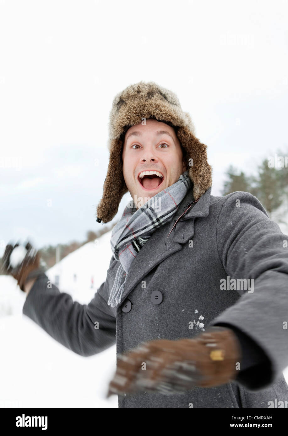 Person throwing snowballs hi-res stock photography and images - Alamy