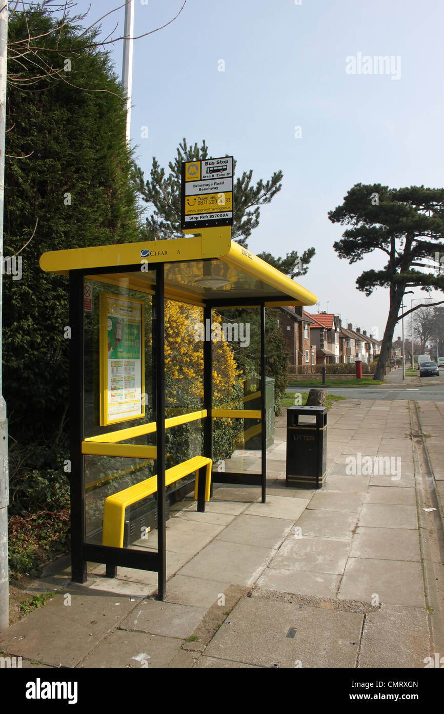 Empty yellow Merseyside transport bus shelter Stock Photo - Alamy