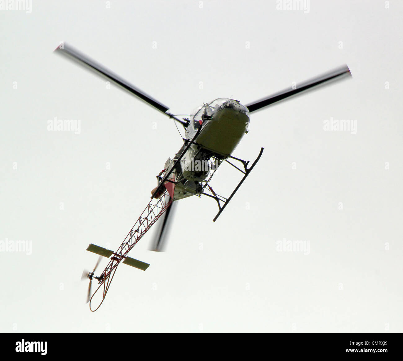Flight of a helicopter viewed from under Stock Photo - Alamy