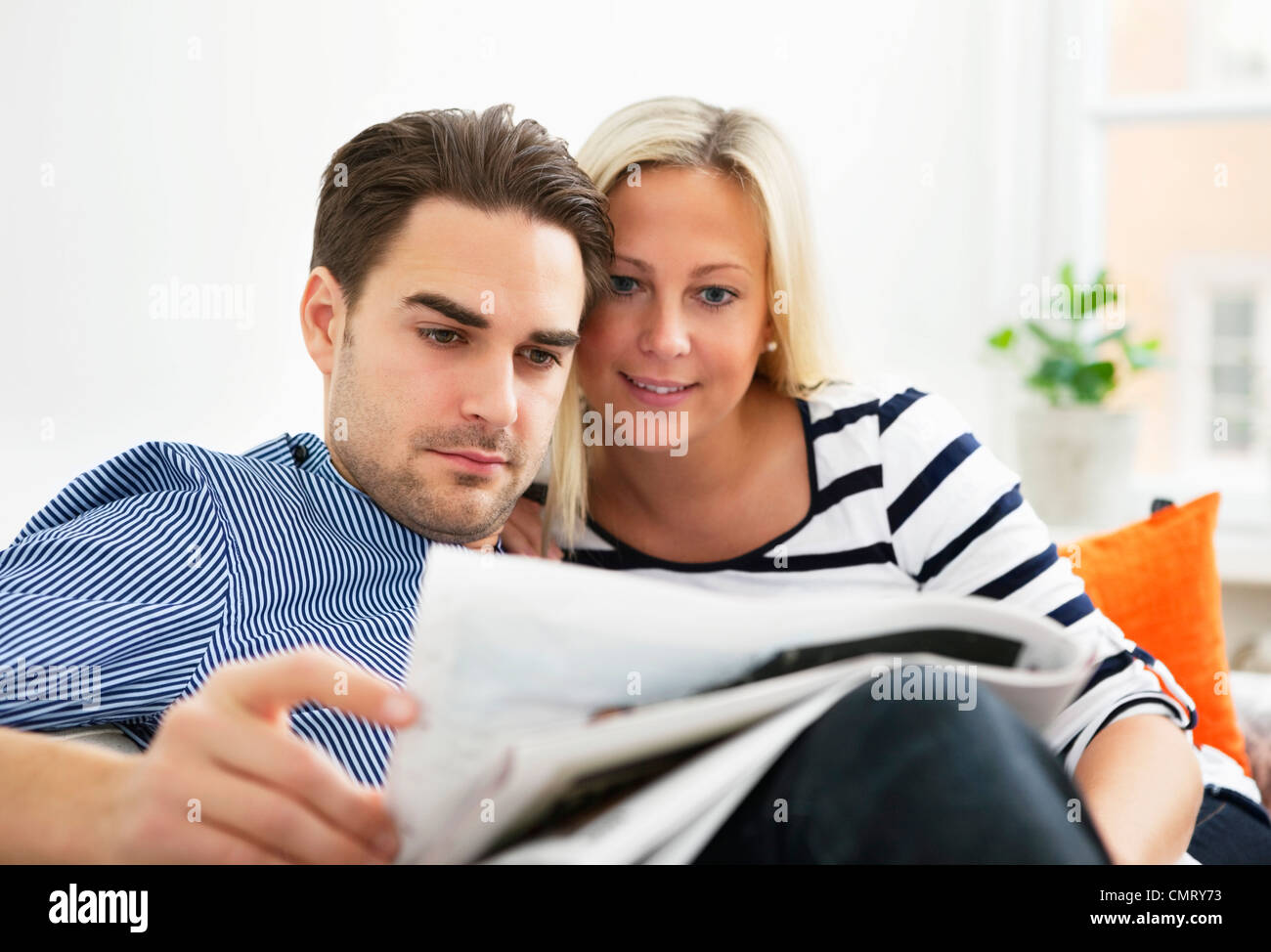 Woman and man reading Stock Photo - Alamy