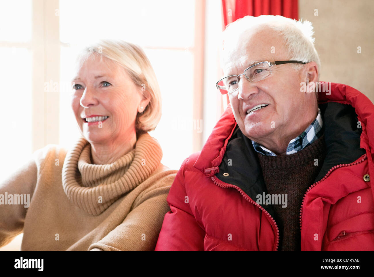 Two people sitting indoors Stock Photo - Alamy