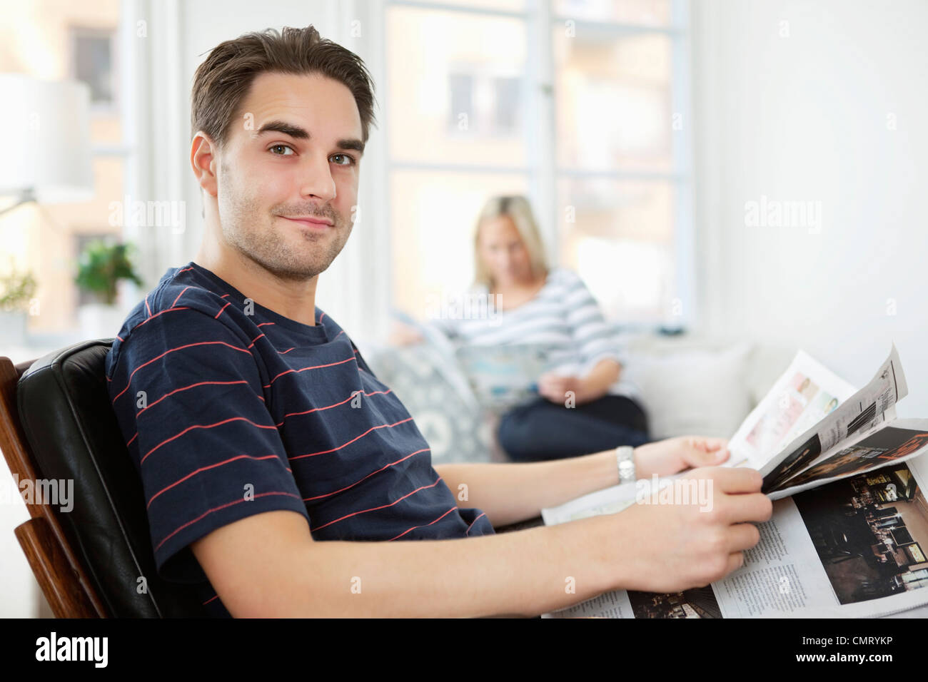 Man reading magazine Stock Photo - Alamy