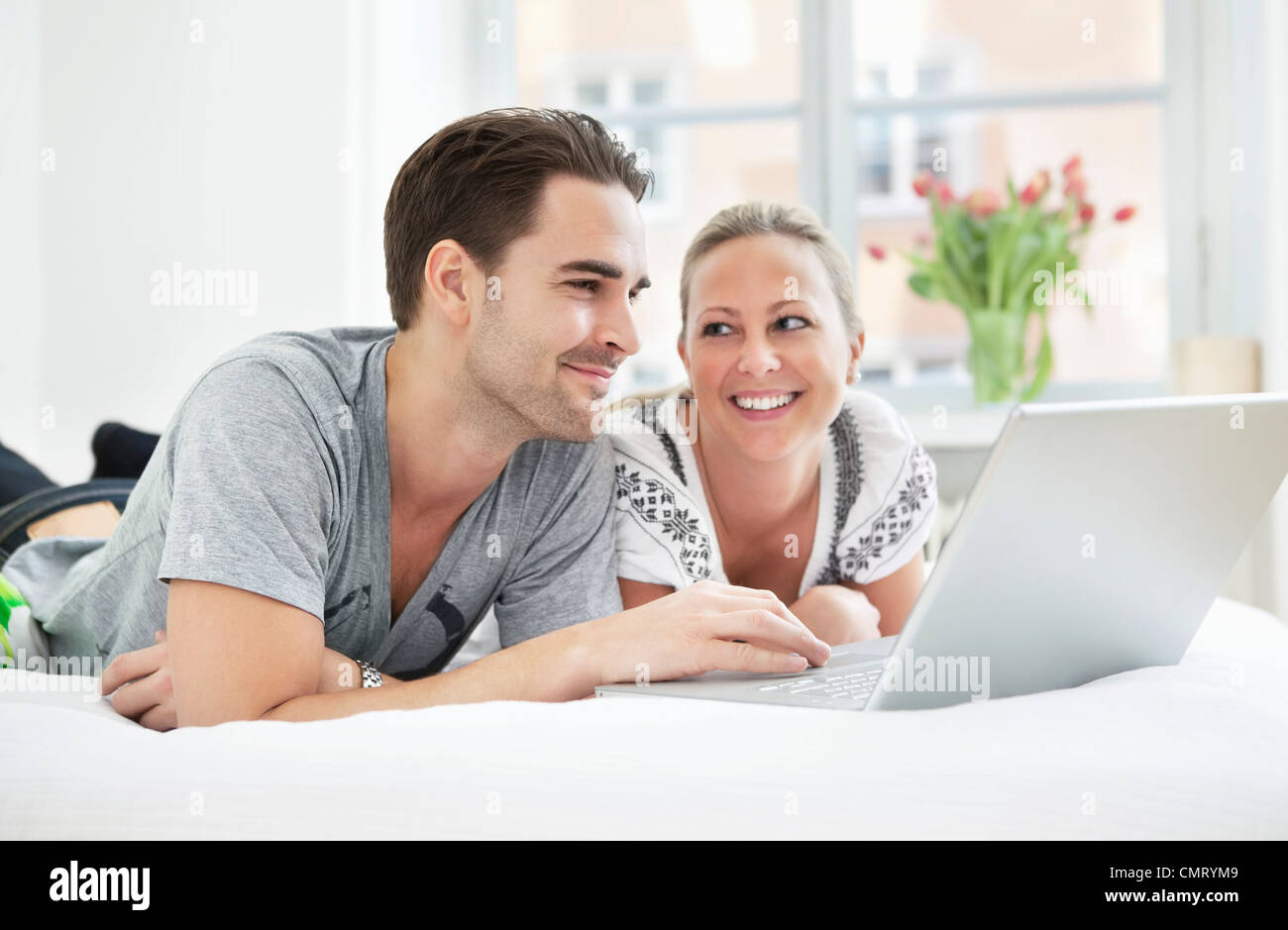 Guy and girl by computer Stock Photo - Alamy