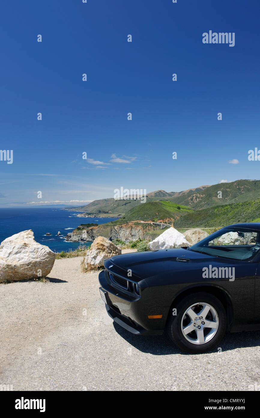 car parked near cliff edge in usa california with blue sky and sea ...
