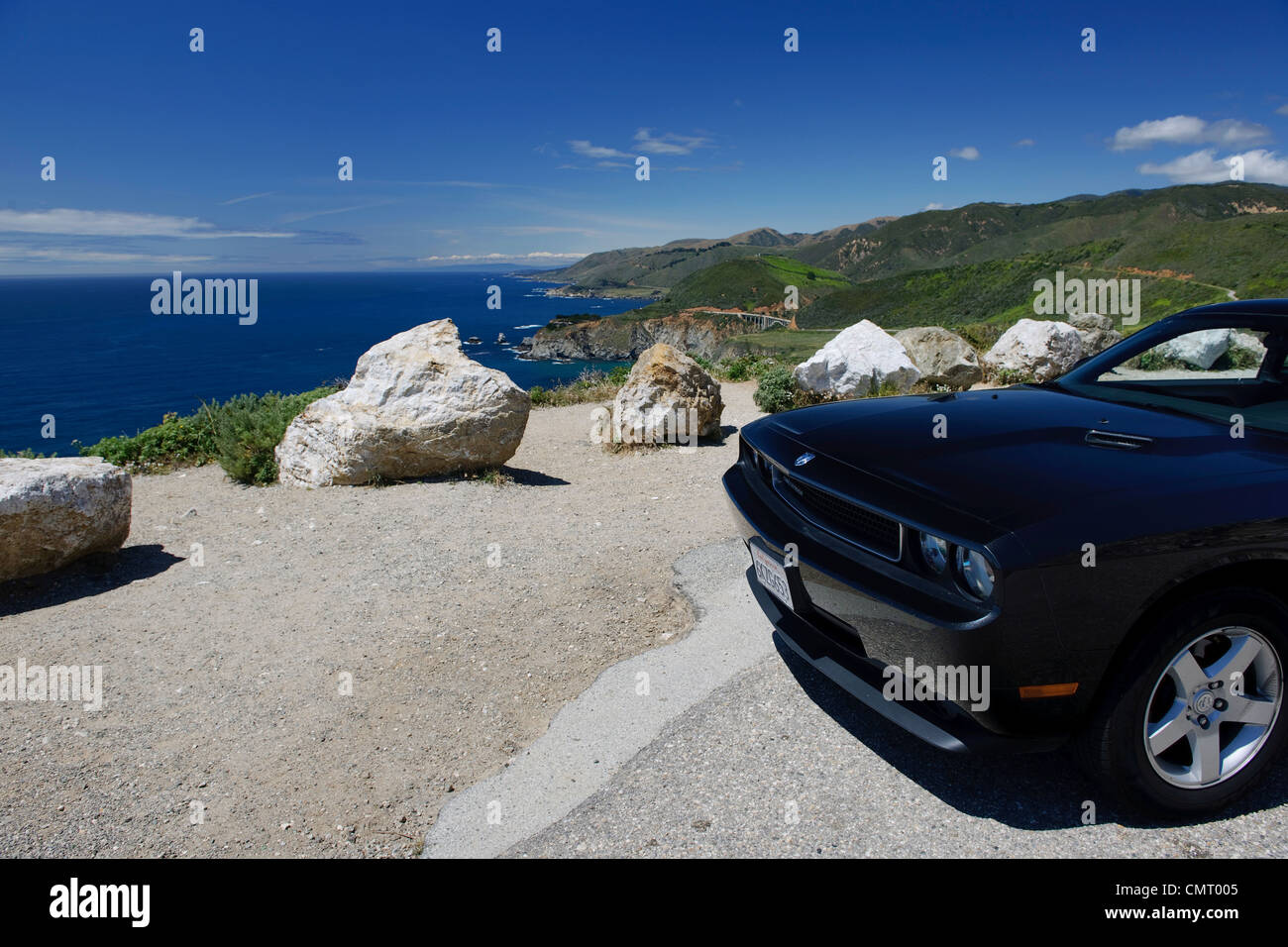 car parked near cliff edge in usa california with blue sky and sea ...