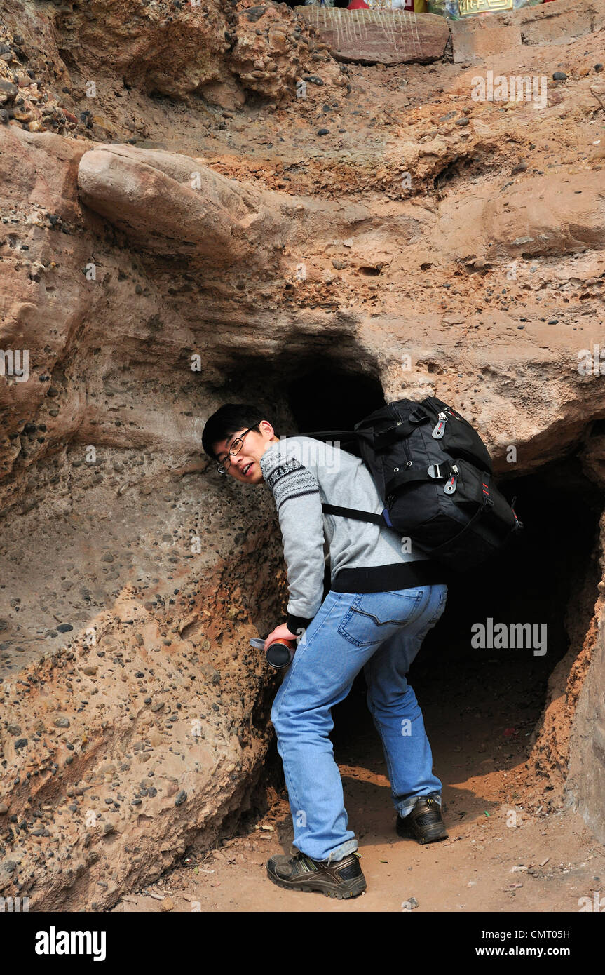 young chinese man is exploring the mountain in chongqing,china Stock ...
