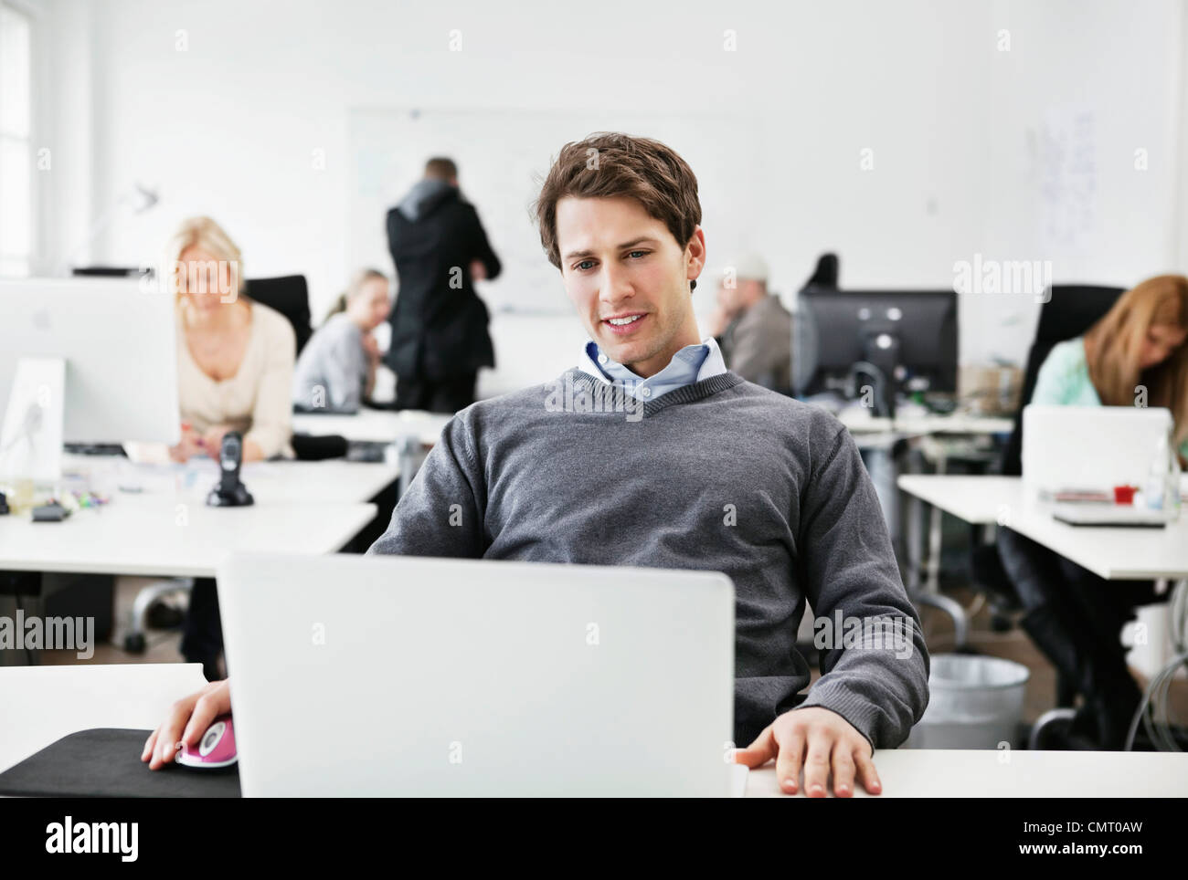 People sitting in the office and concentrating on their work Stock ...