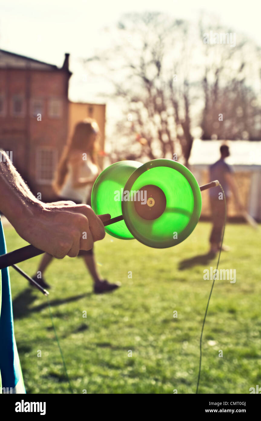 A performing artist practicing with a Diabolo Stock Photo - Alamy