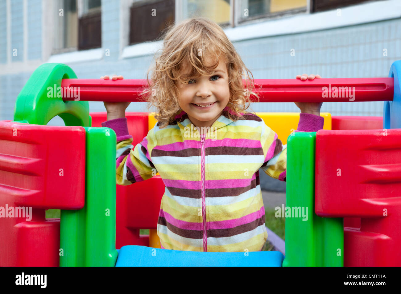 little smiling child playing outdoors Stock Photo - Alamy