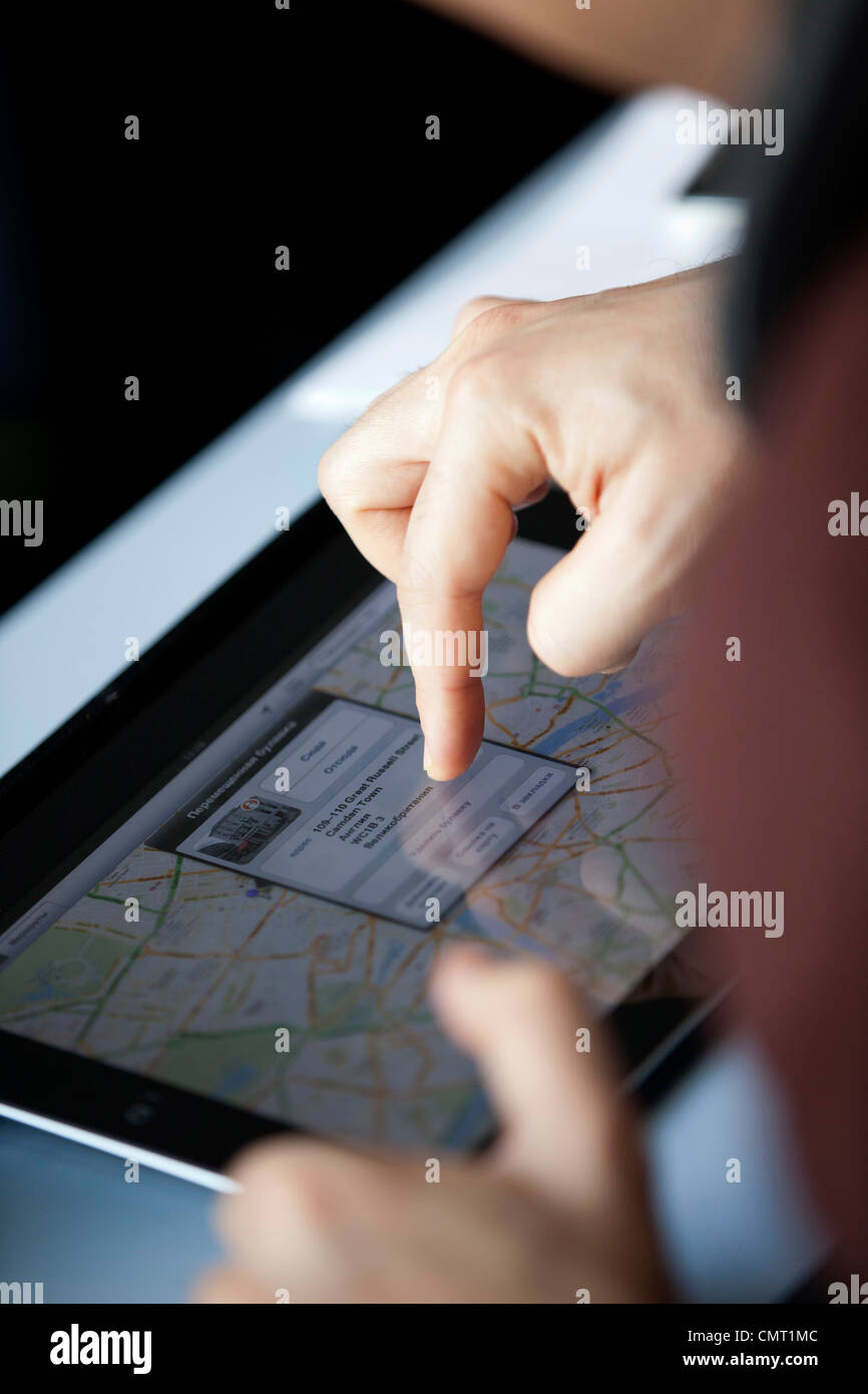 man using apple ipad at conference Stock Photo - Alamy