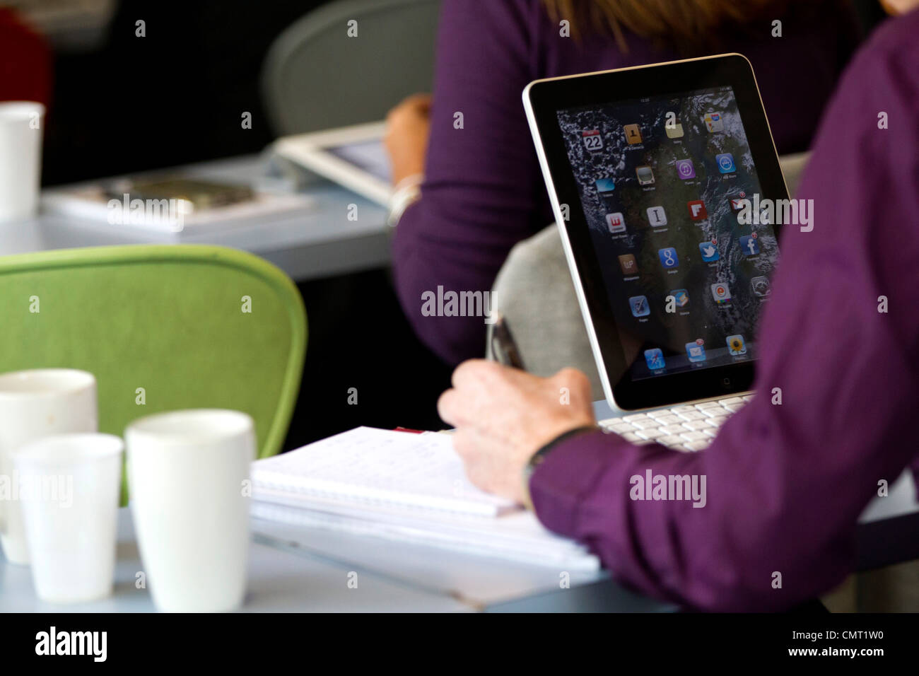 man using apple ipad at conference Stock Photo - Alamy