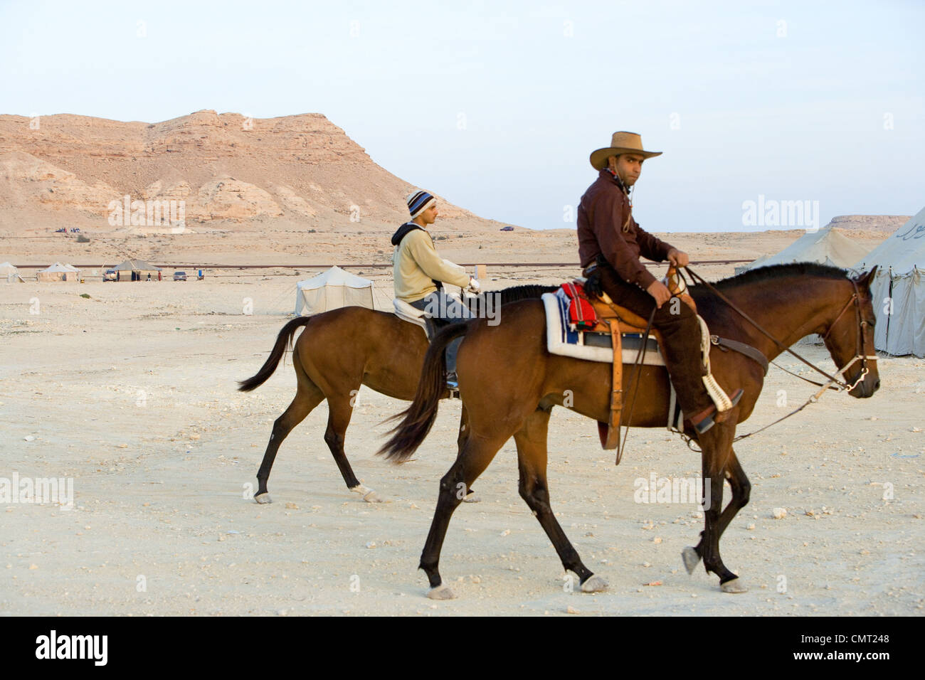 Bahrain, local people riding in the central desert area Stock Photo - Alamy