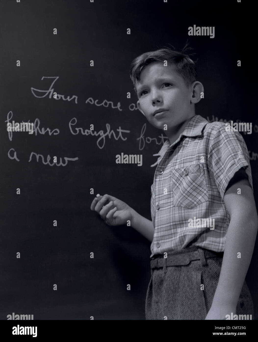 1940s GRADE SCHOOL BOY AT CHALKBOARD WRITING OUT GETTYSBURG ADDRESS ...