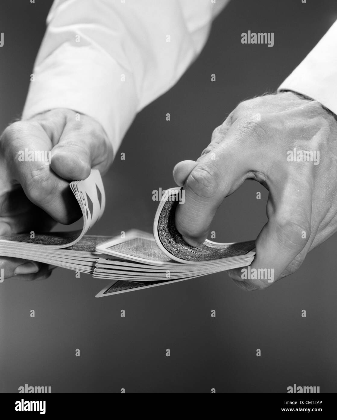 Shuffling cards 1960s hi-res stock photography and images - Alamy