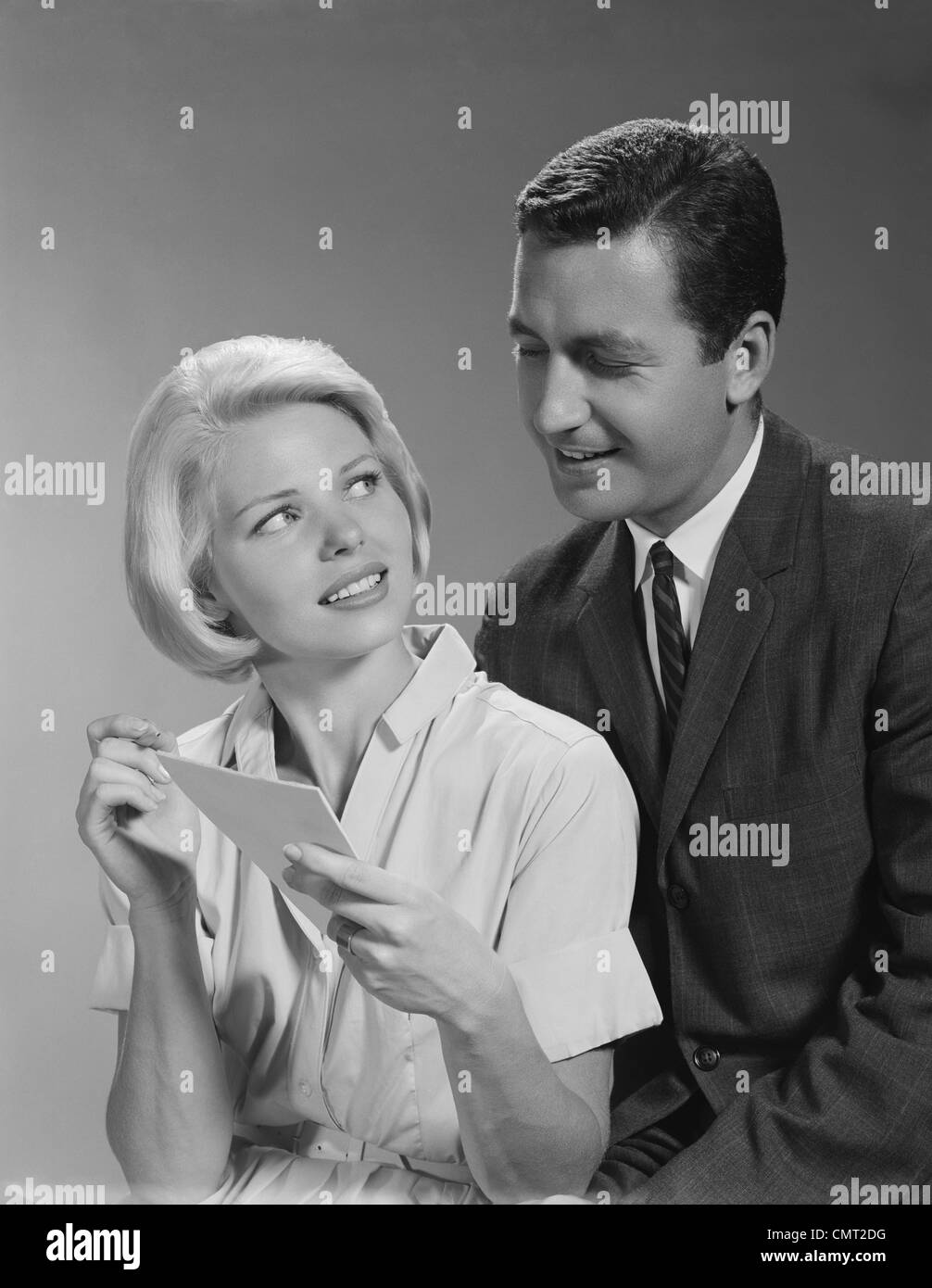 Woman looking at list Black and White Stock Photos & Images - Alamy