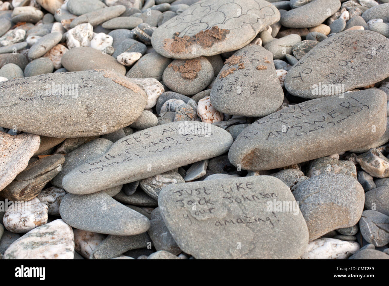 Pebbles on a beach at Gwithian, Cornwall with written messages Stock ...