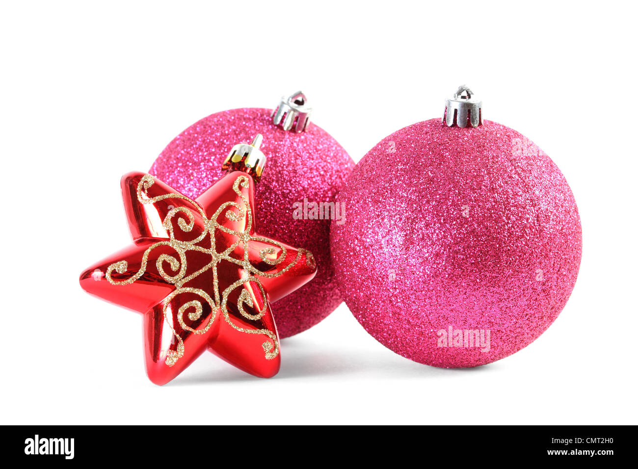 Two red Christmas tree balls and star isolated on white, focus on front ...