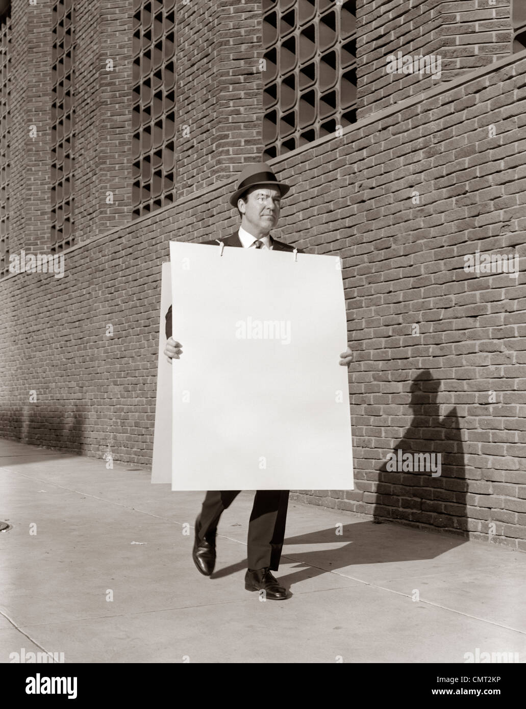 1950s BUSINESSMAN WALKING SIDEWALK WEARING ADVERTISING SANDWICH BOARD ...