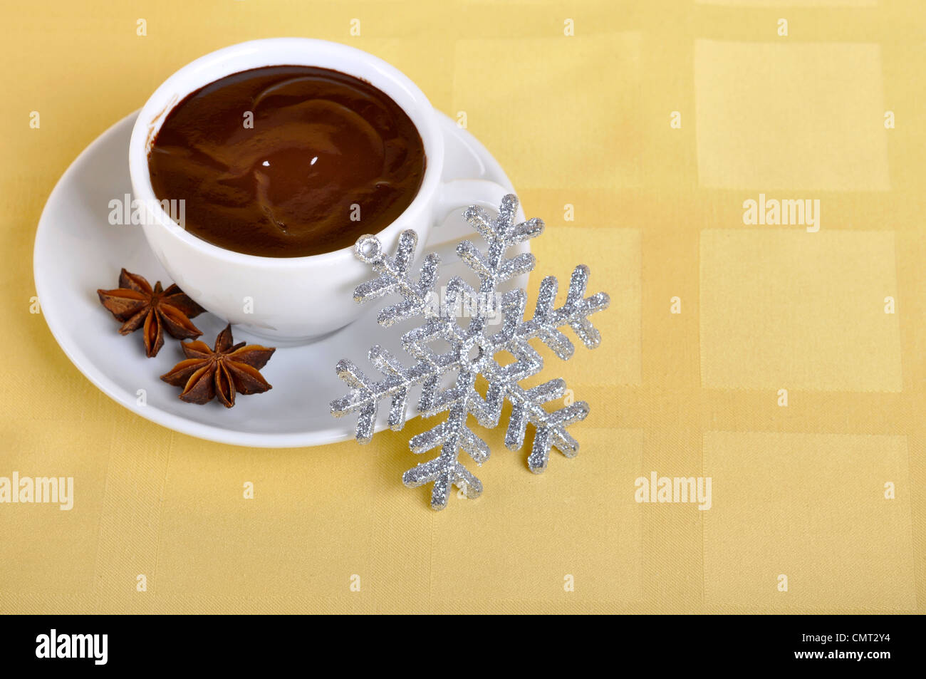 Cup of hot chocolate with decorative silver snowflake Stock Photo - Alamy