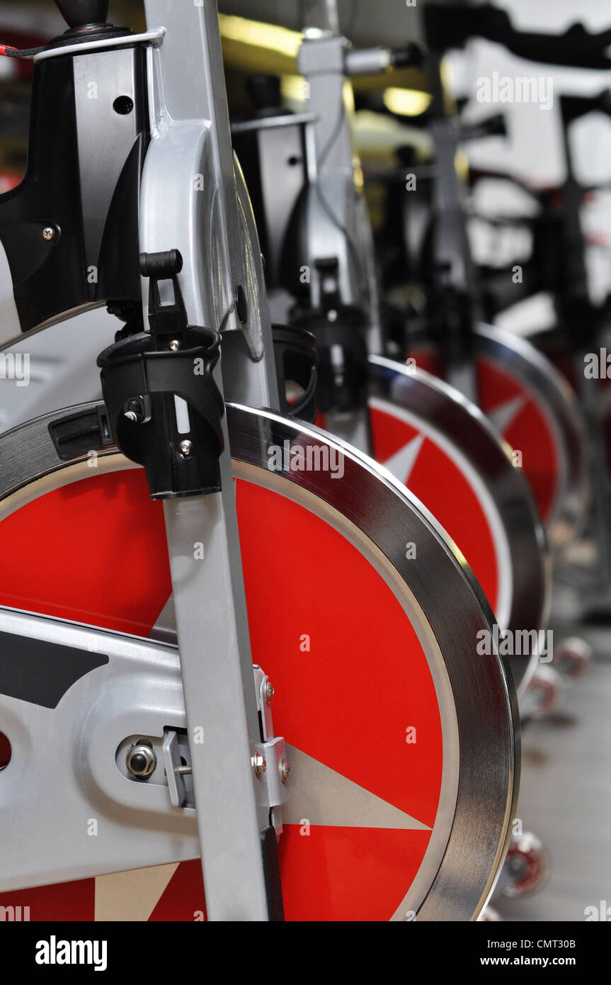 red fitness cycle wheel closup in the gym Stock Photo - Alamy