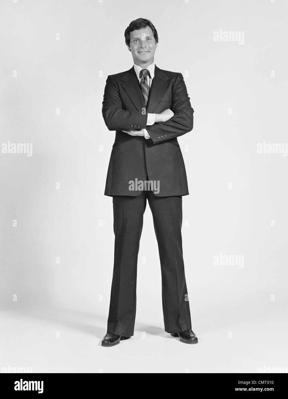1970s 1980s SMILING MAN STANDING WEARING BUSINESS SUIT Stock Photo - Alamy