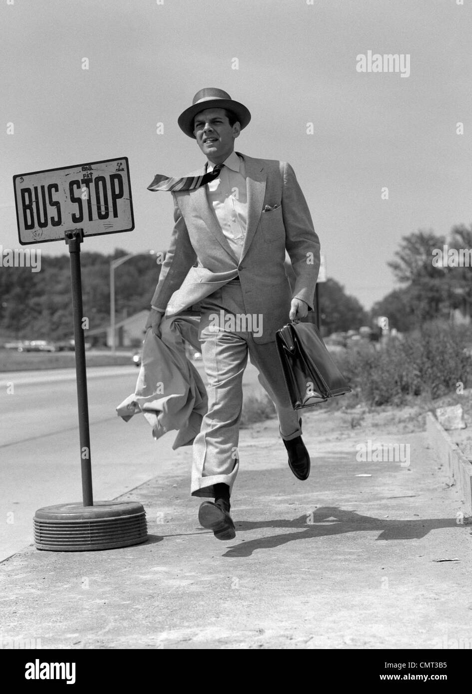1950s SALESMAN RUNNING TO CATCH BUS AT BUS STOP SIGN OUTDOOR Stock ... 1950s SALESMAN RUNNING TO CATCH BUS AT BUS STOP SIGN OUTDOOR Stock ...