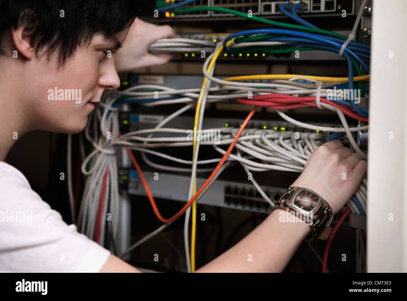 Woman pulling network cables Stock Photo - Alamy