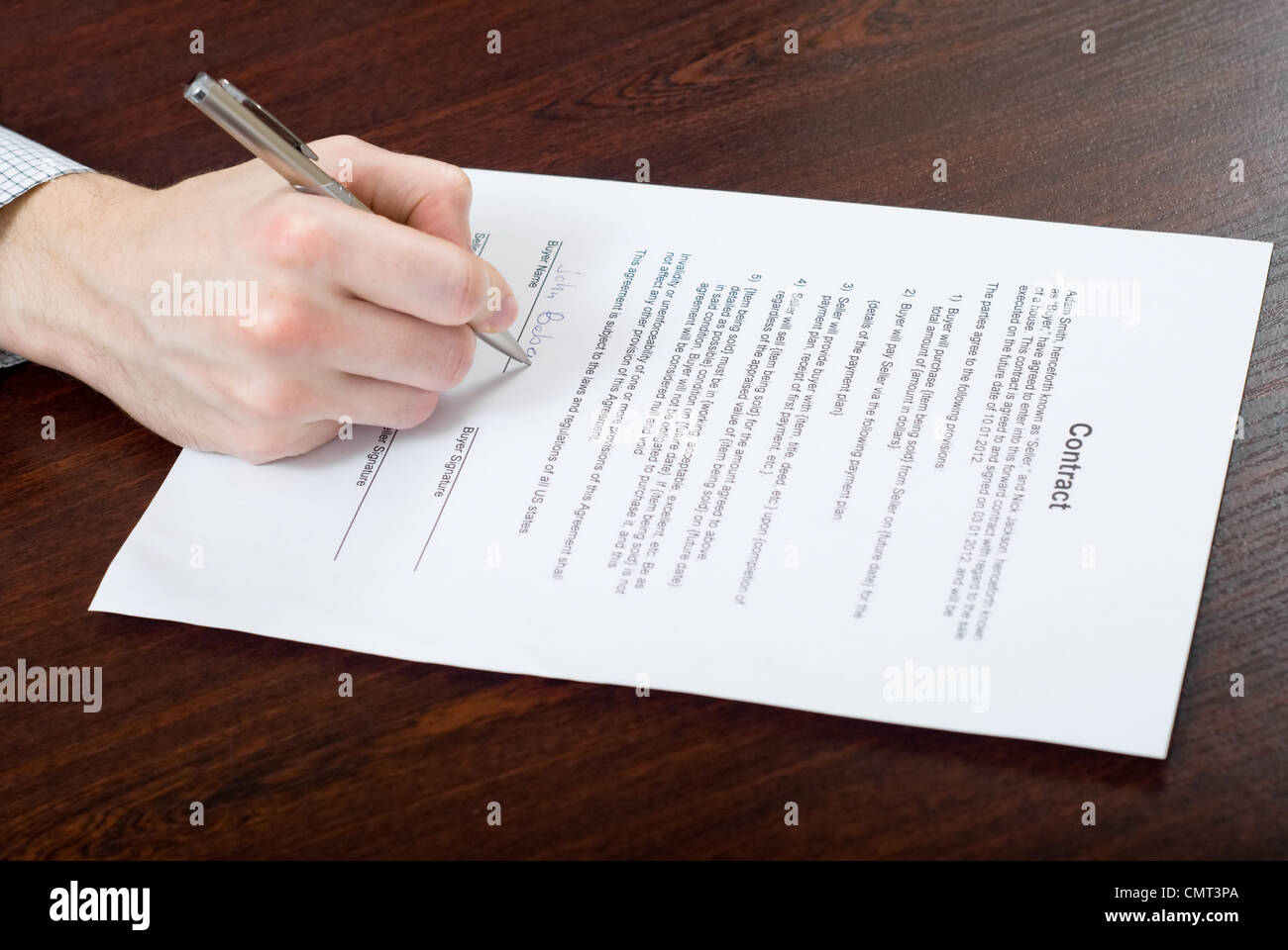 Signing contract by businessman Stock Photo - Alamy