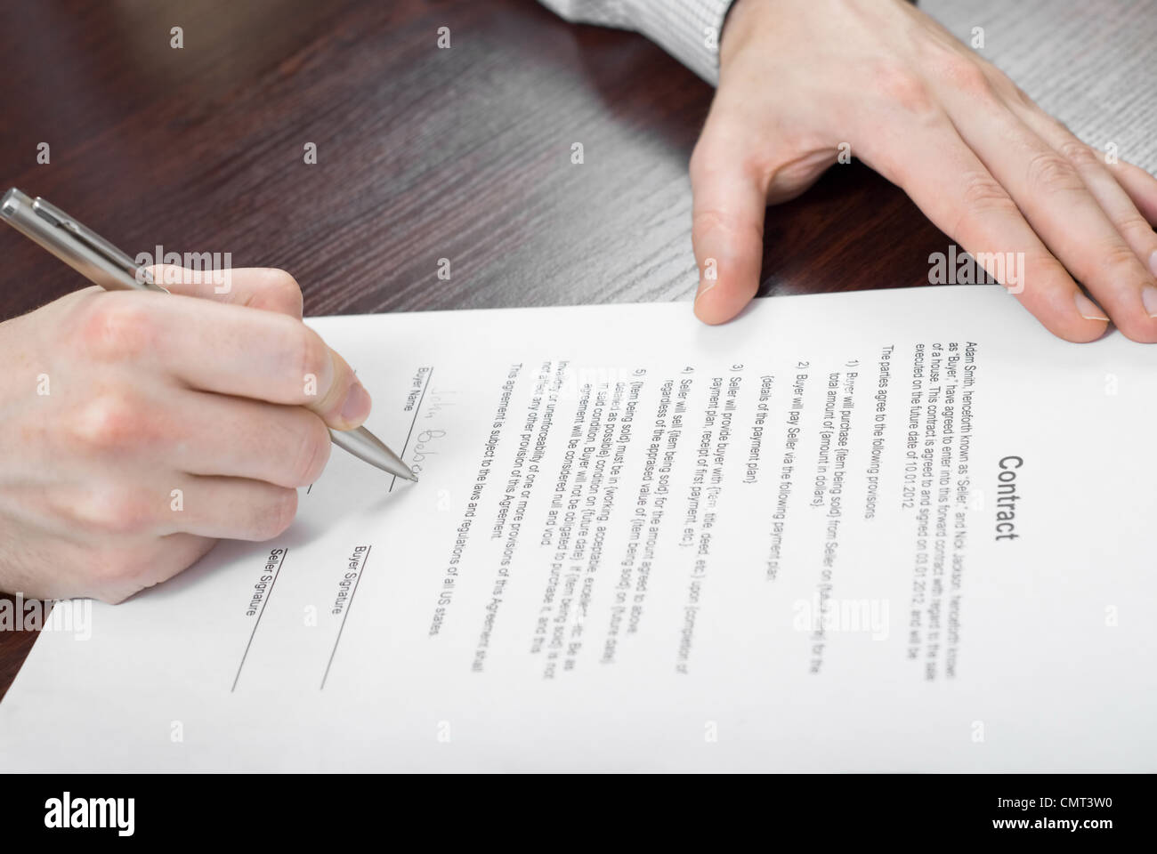 Signing contract by businessman Stock Photo - Alamy