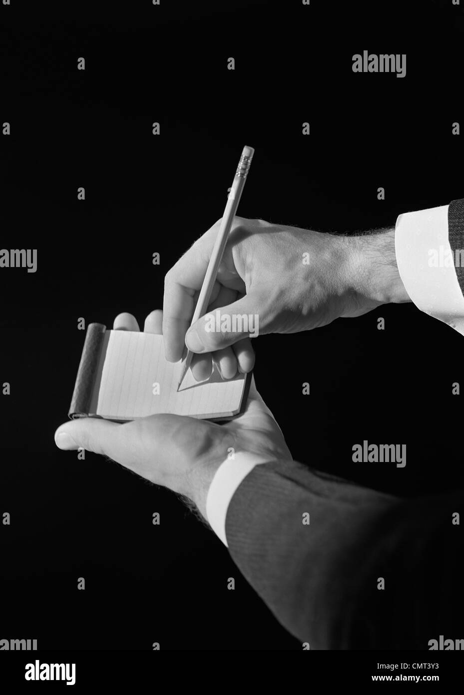 1930s MAN’S HANDS WRITING ON NOTE PAD WITH PENCIL Stock Photo - Alamy