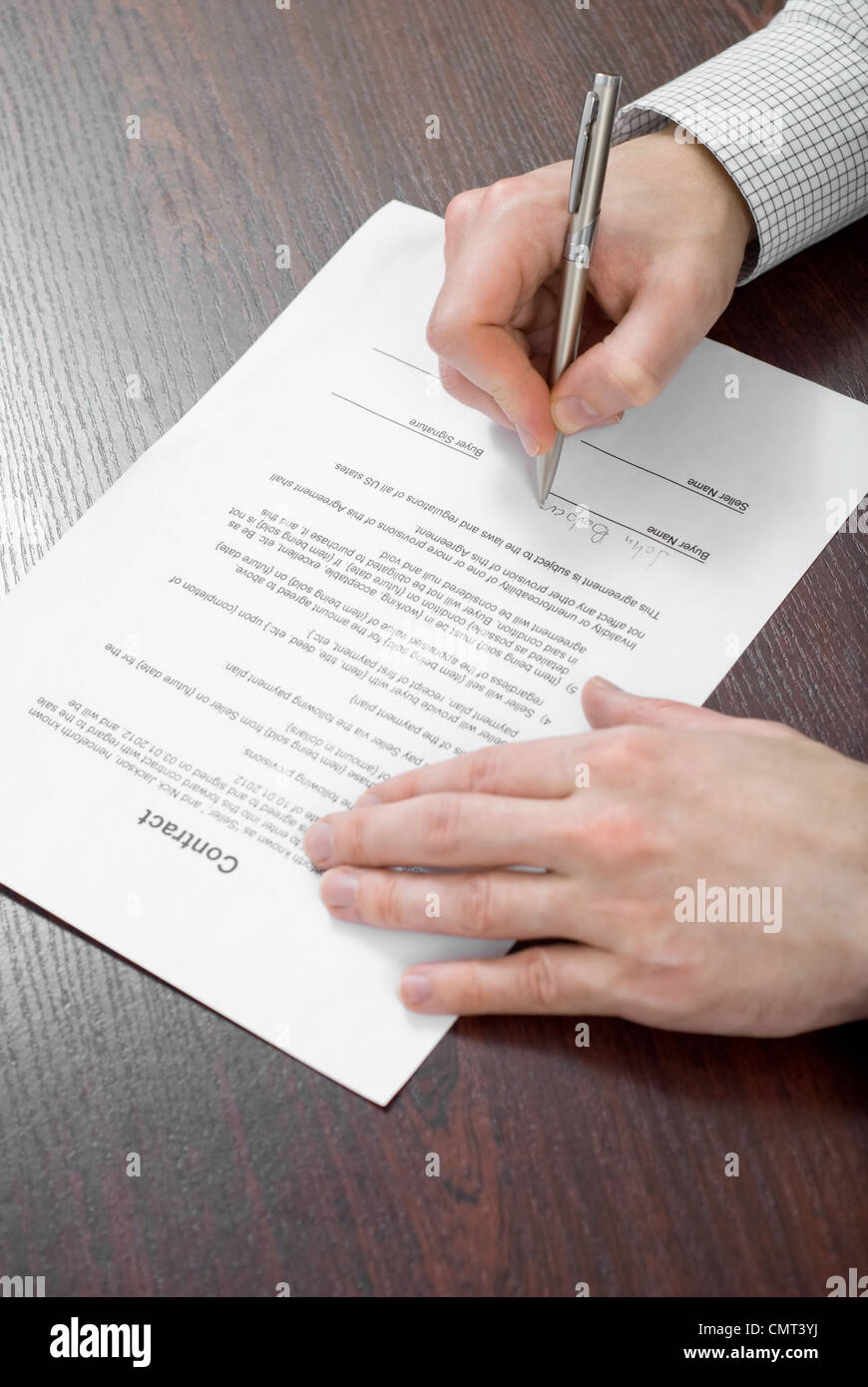 Signing contract by businessman Stock Photo - Alamy