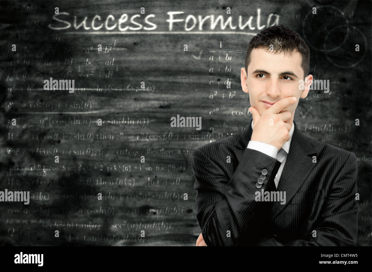 A young businessman who is thinking about a formula for success Stock ...
