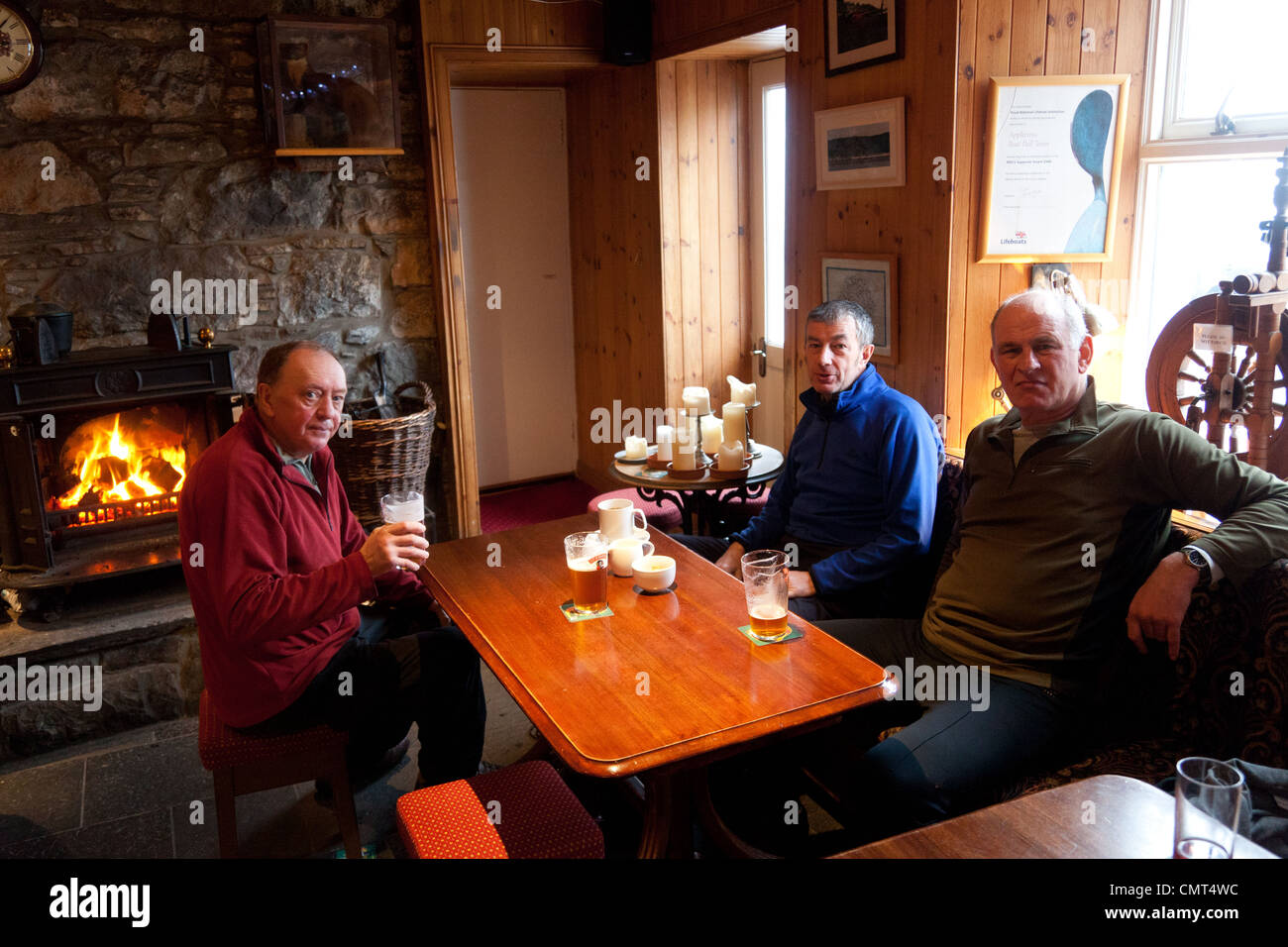 3 men drinking in the bar of the Applecross Inn in the Highlands of ...