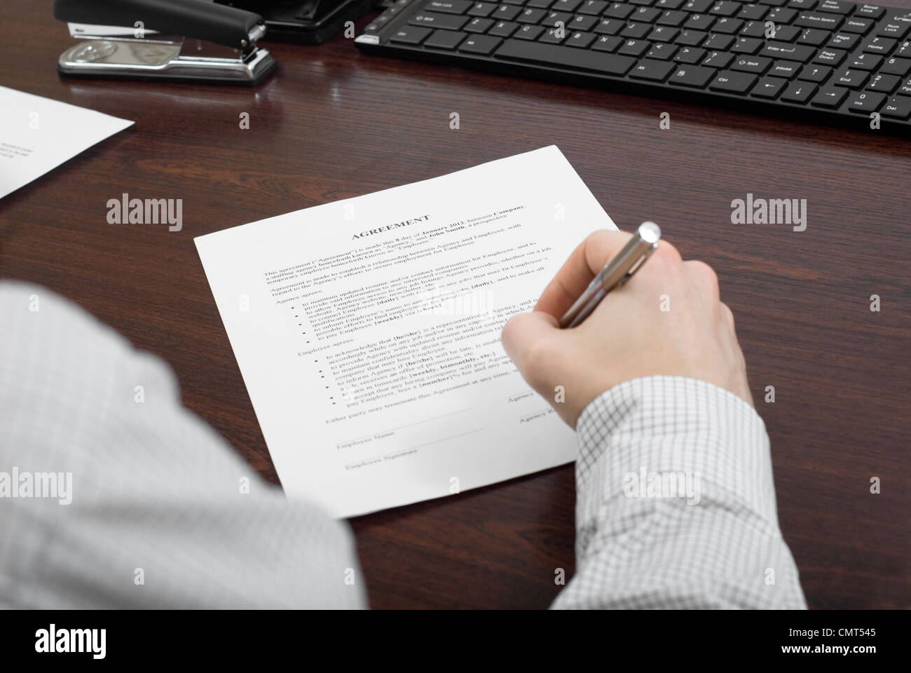 Businessman filling out form desk hi-res stock photography and images ...