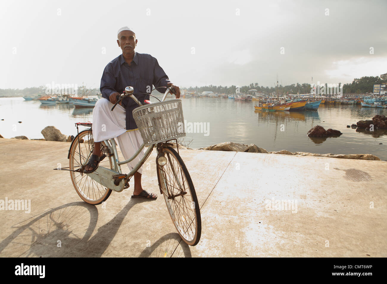 Muslim man on Bicycle Stock Photo - Alamy