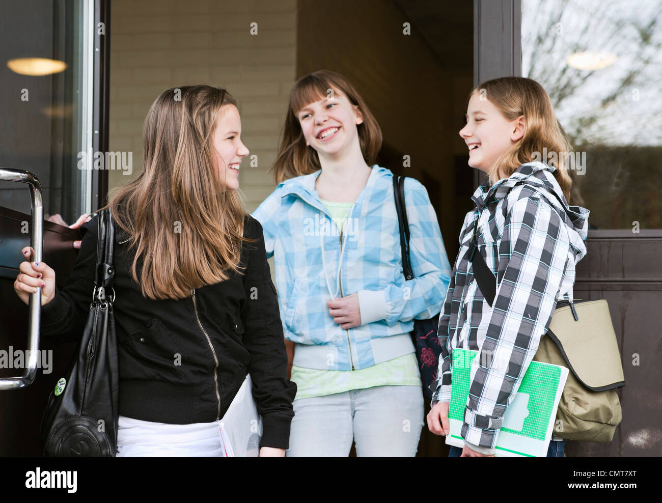 Three female friends spending time together Stock Photo - Alamy