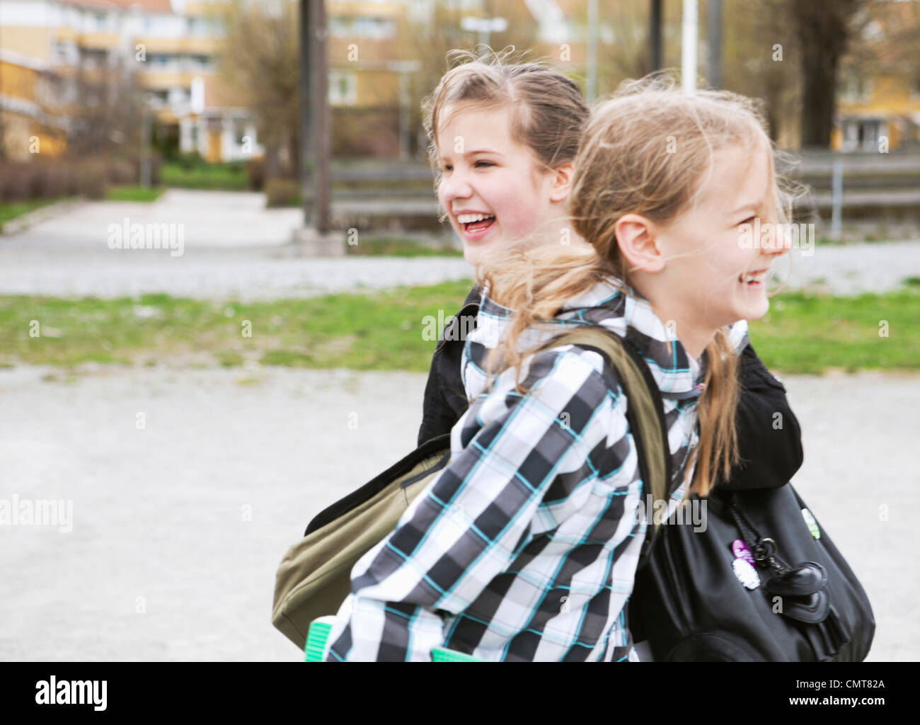 Two girls (12-13) laughing Stock Photo - Alamy