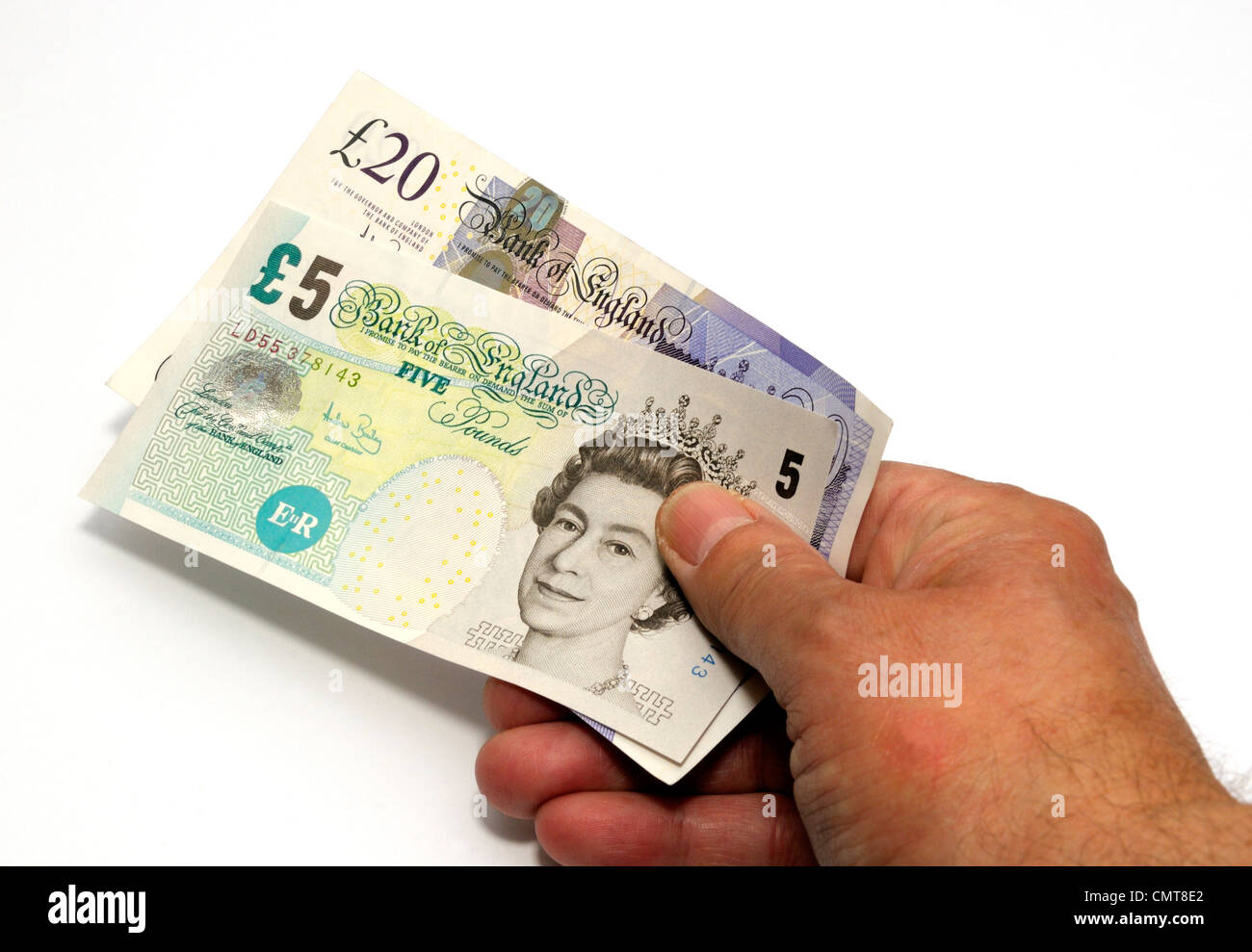 Hand holding british banknotes hi-res stock photography and images - Alamy