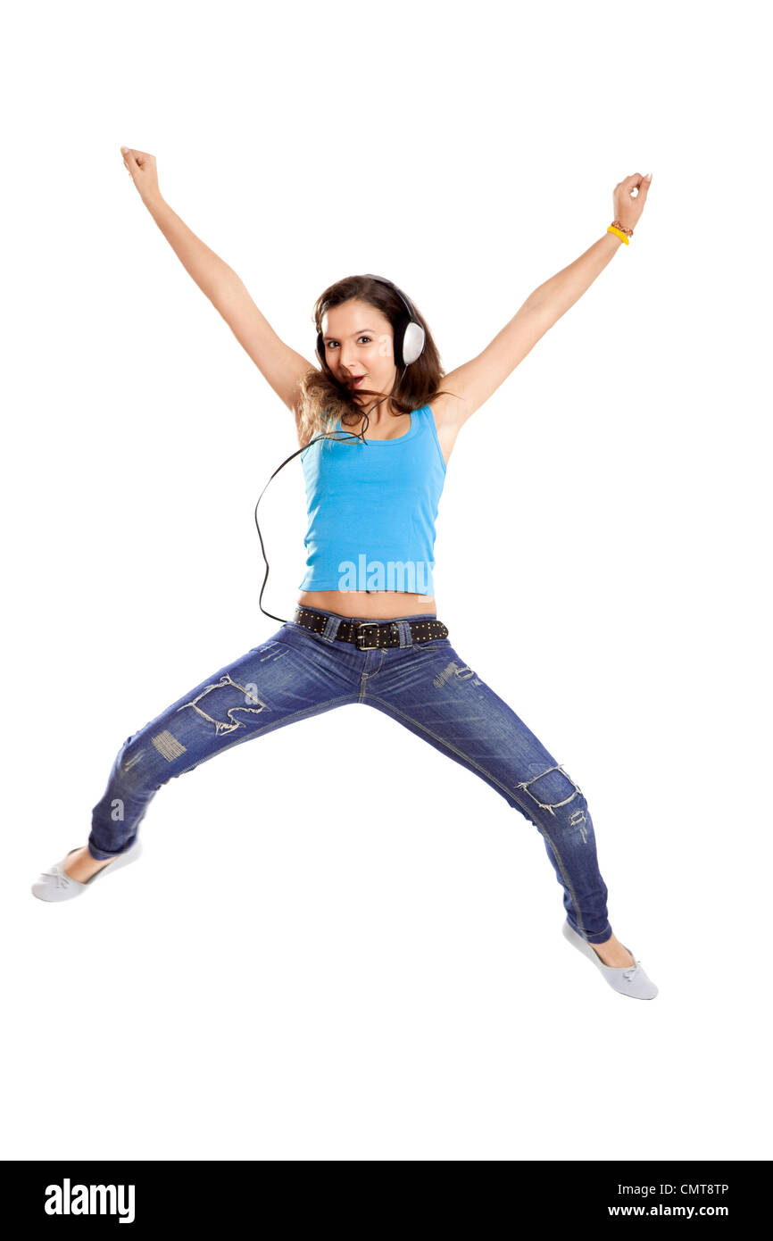 Beautiful young girl dancing and listen music, isolated on white Stock ...