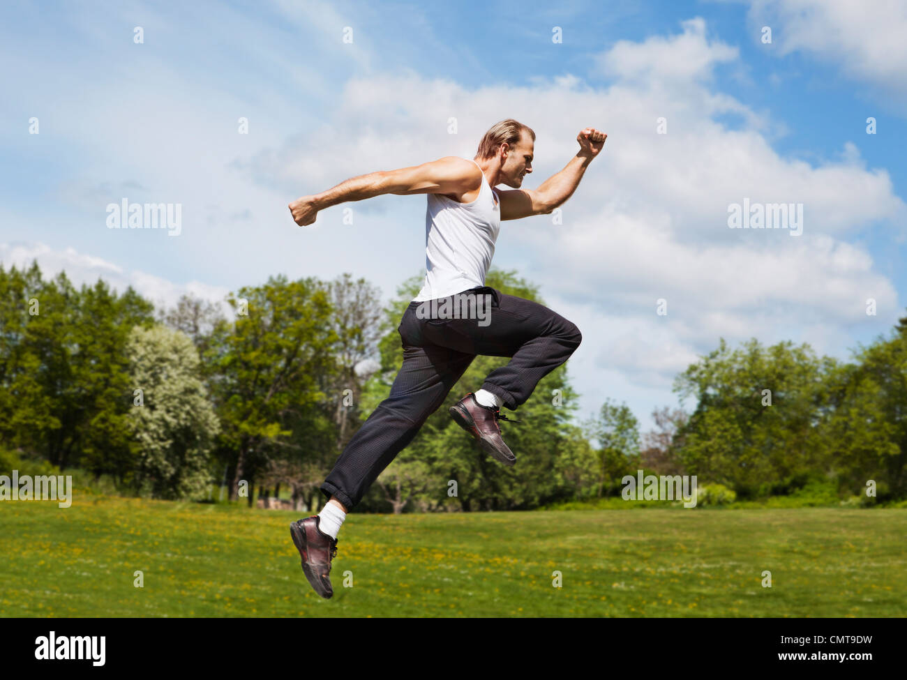 Man in the middle of jump Stock Photo - Alamy
