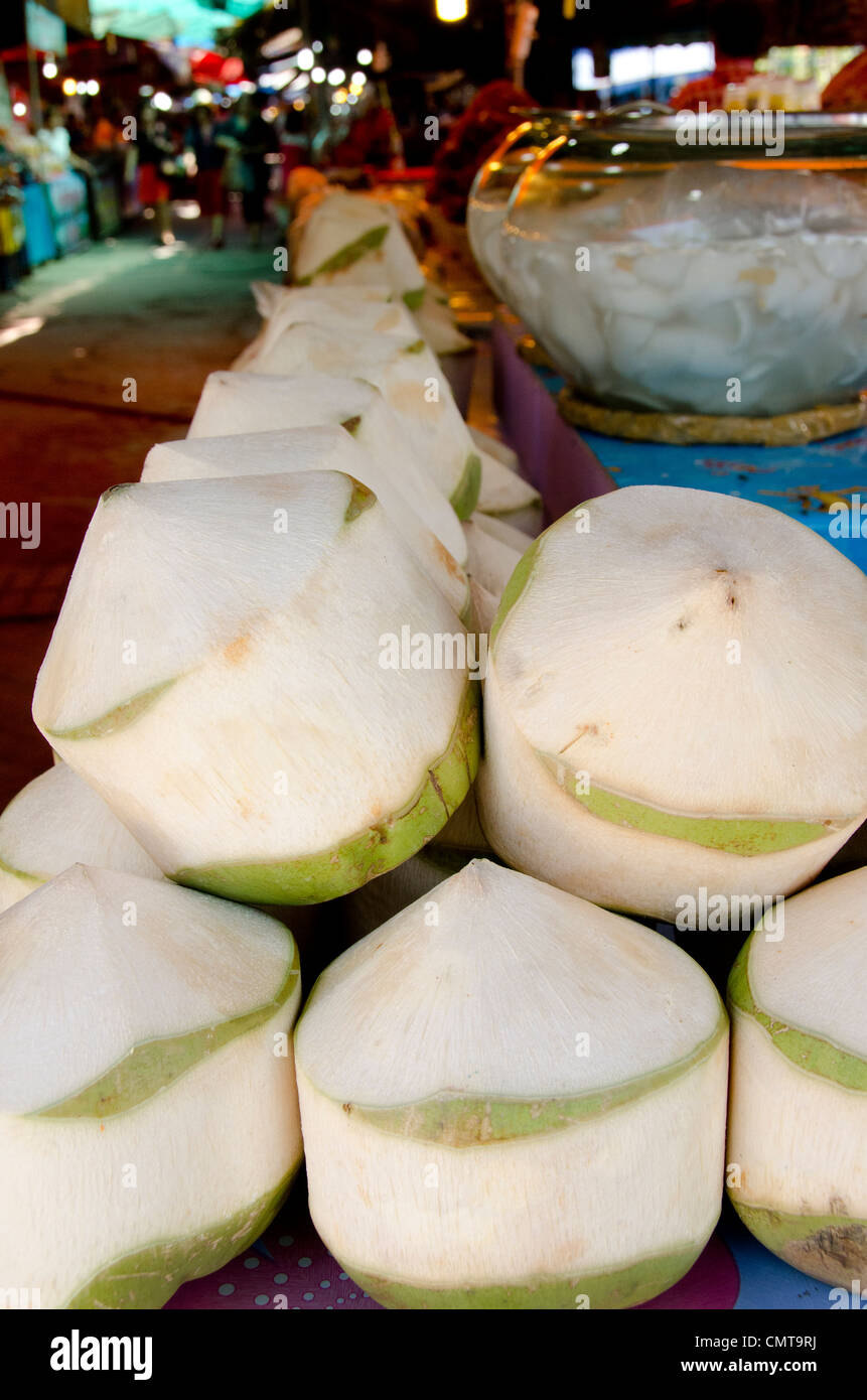 Thailand, Ayutthaya. Local street market. Fresh coconut, chilled and ...