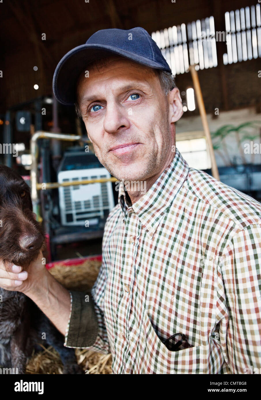 Close-up of farmer smiling Stock Photo - Alamy